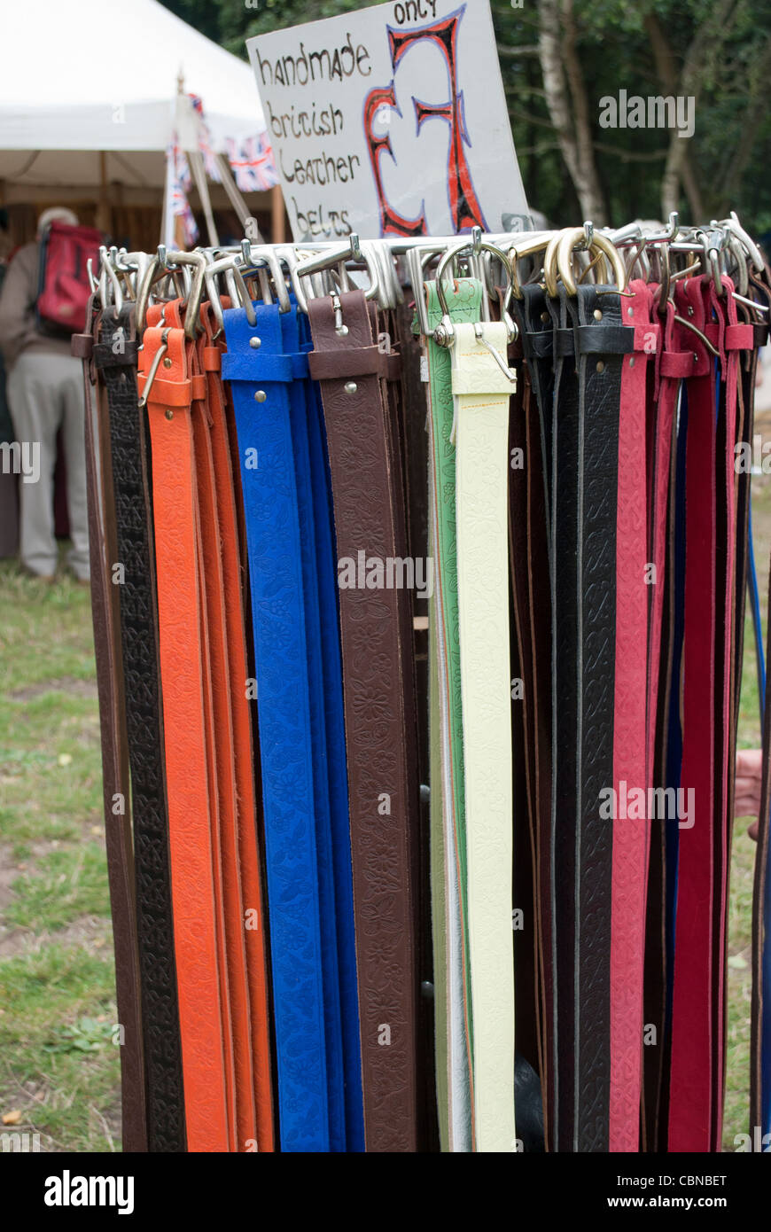 Rack of different coloured handmade British leather belts for sale at ...