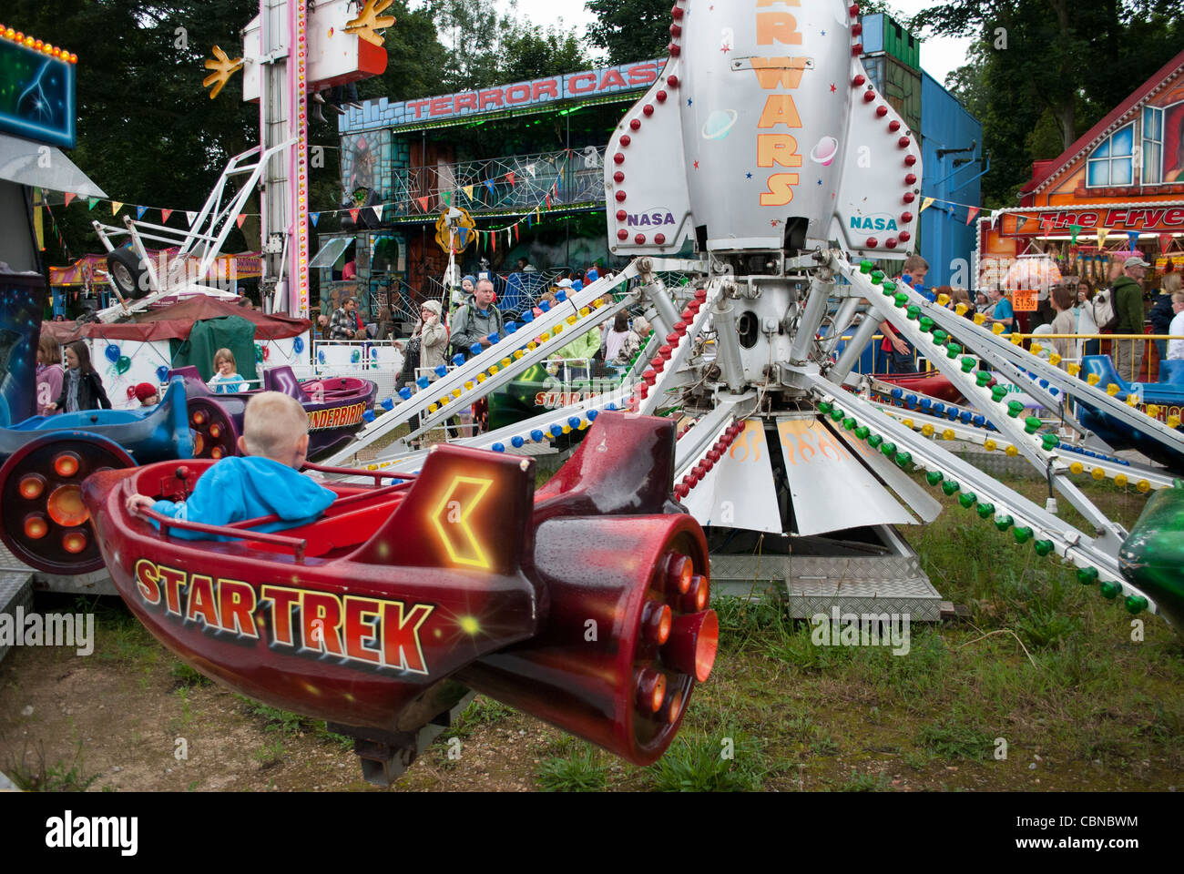 Fairground roundabout Star Wars rocket ride with red Star Trek ...