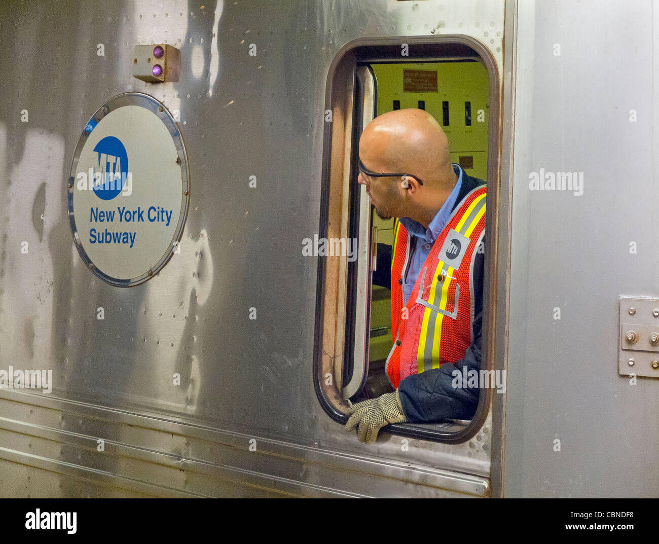 subway conductor in train car Stock Photo - Alamy