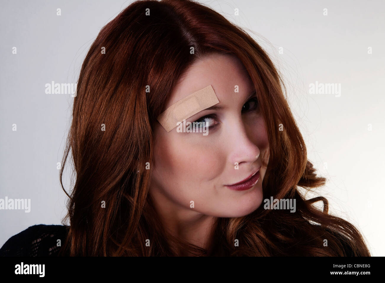woman with a large plaster on her face Stock Photo - Alamy