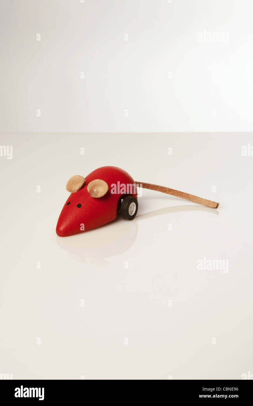 red toy mouse with wheels on white background Stock Photo - Alamy
