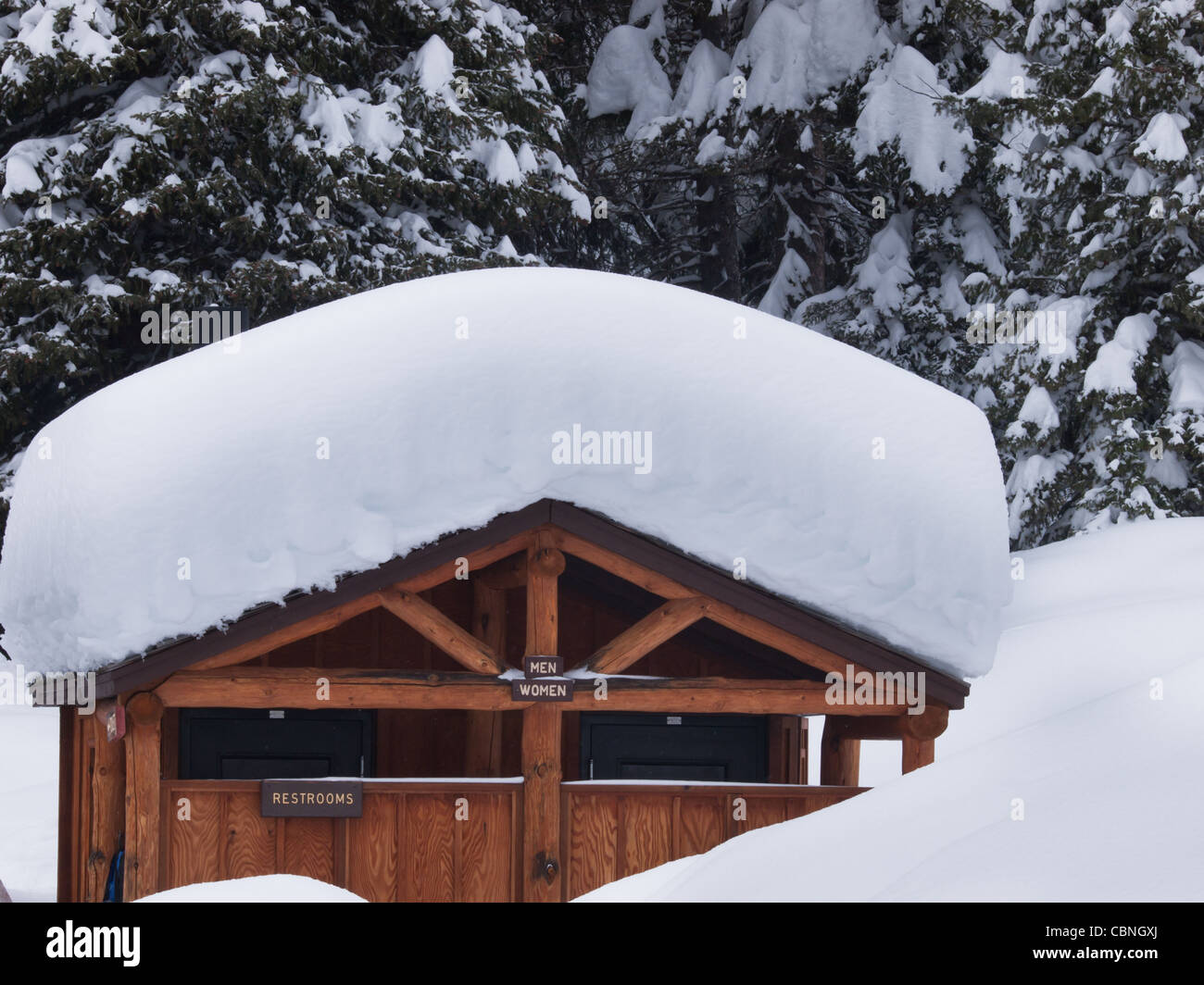 Restroom structure covered with snow near Granite Hot Springs, Jackson ...