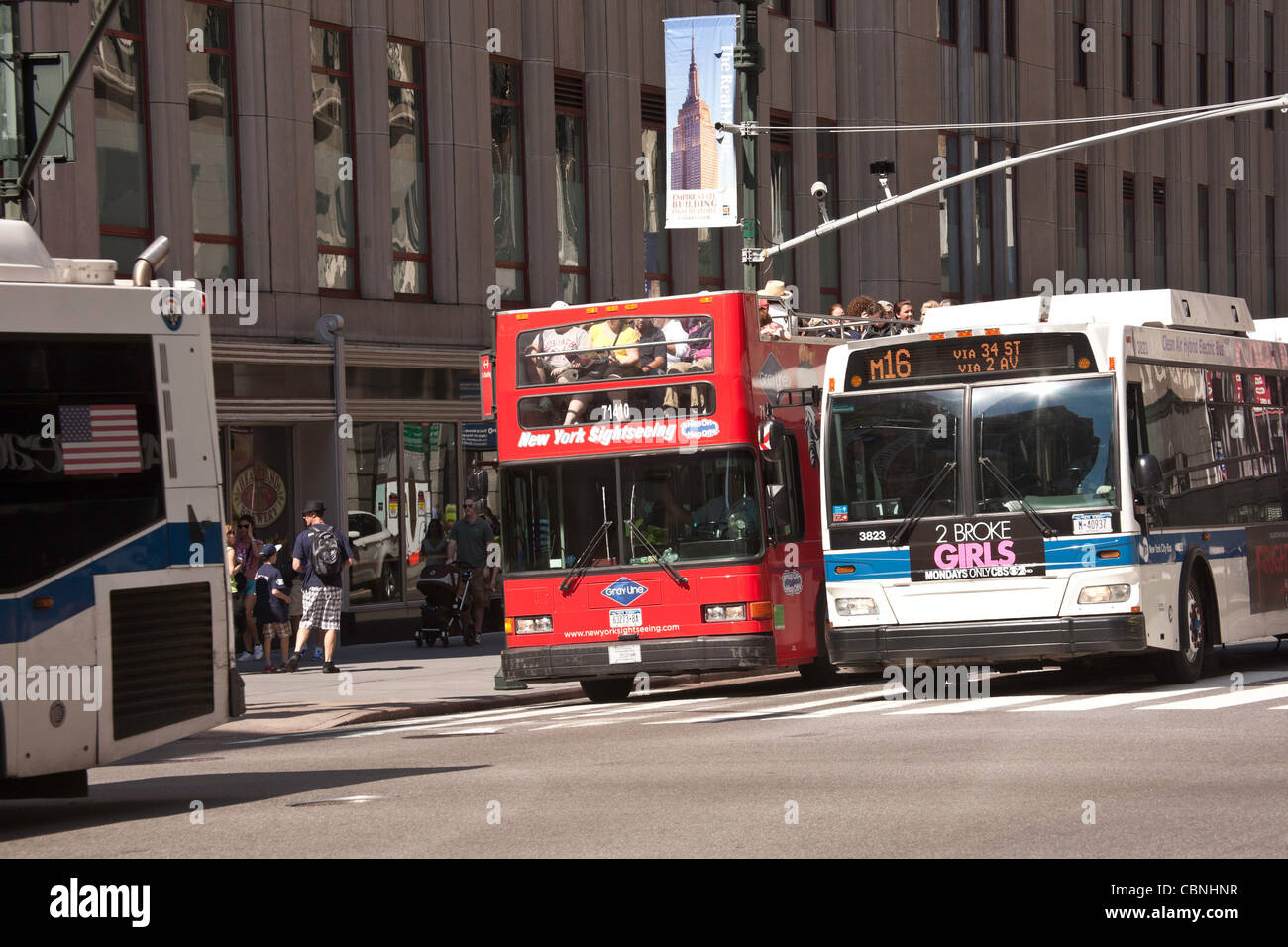 Double Decker Tourist Bus and MTA Buses, 34th Street, NYC Stock Photo ...