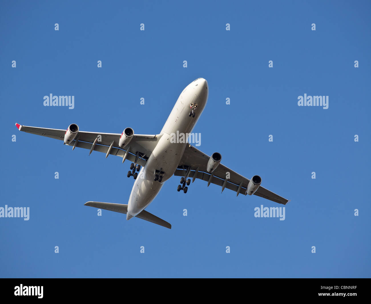 airplane fly on the blue sky Stock Photo - Alamy