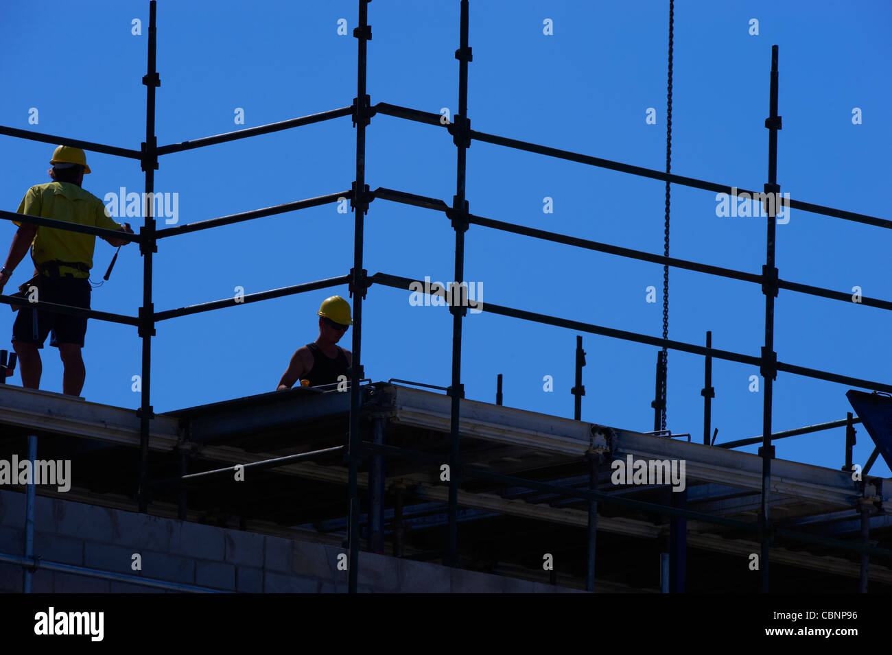 Construction workers on building site Stock Photo - Alamy