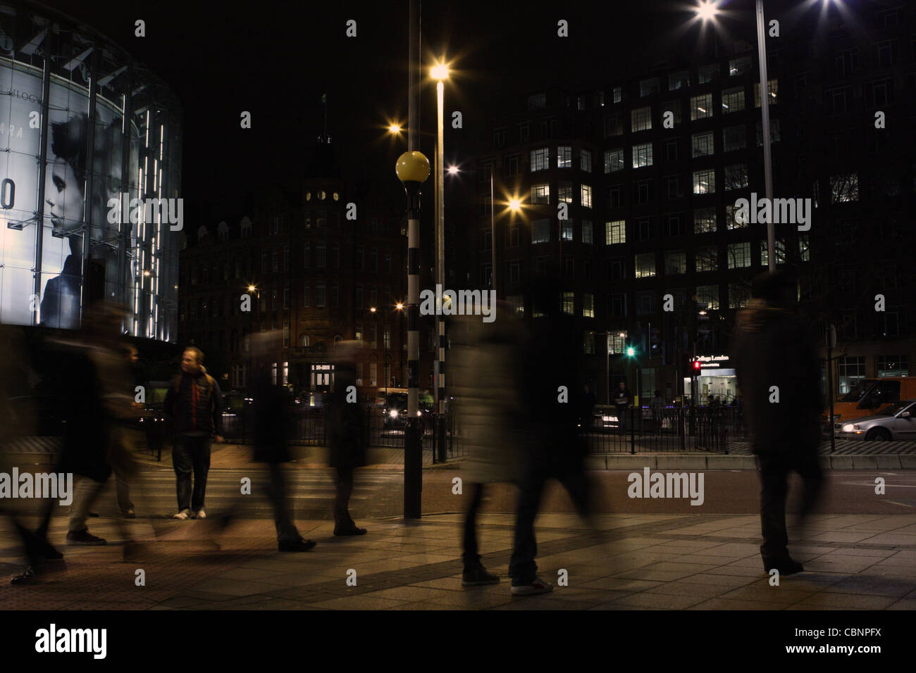 An night shot at Waterloo, London showing people walking by during the ...