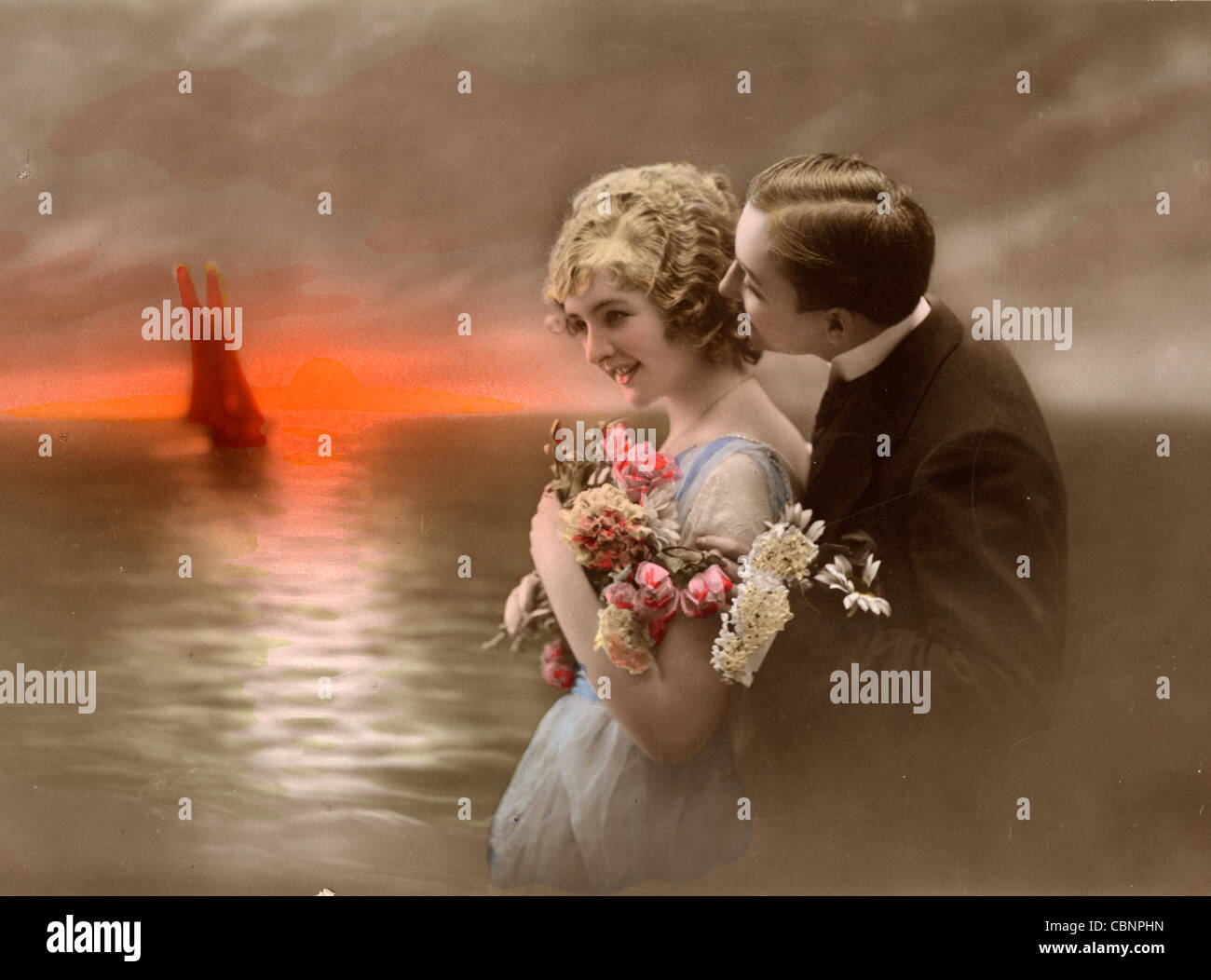 Romantic Lovers at Sunset by the Sea Stock Photo - Alamy