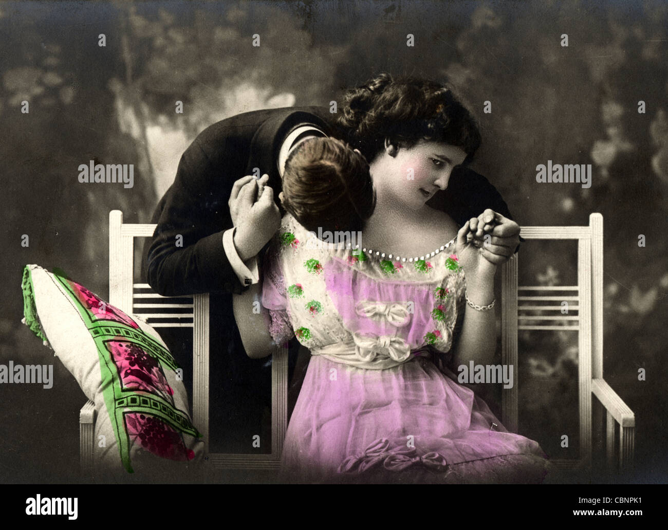 Man Nibbling on Woman's Shoulder Stock Photo - Alamy