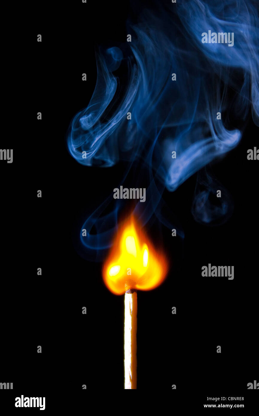 match burning with fire and smoke isolated on black background Stock ...