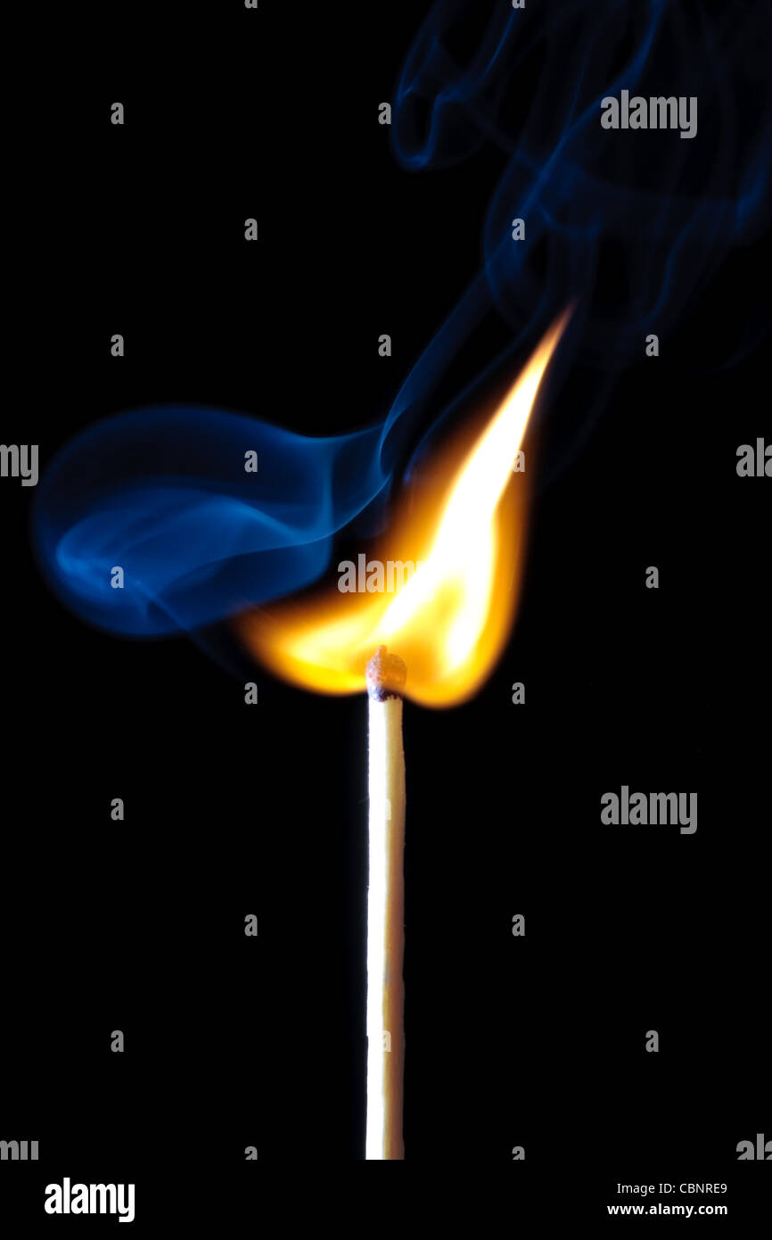 match burning with fire and smoke isolated on black background Stock ...