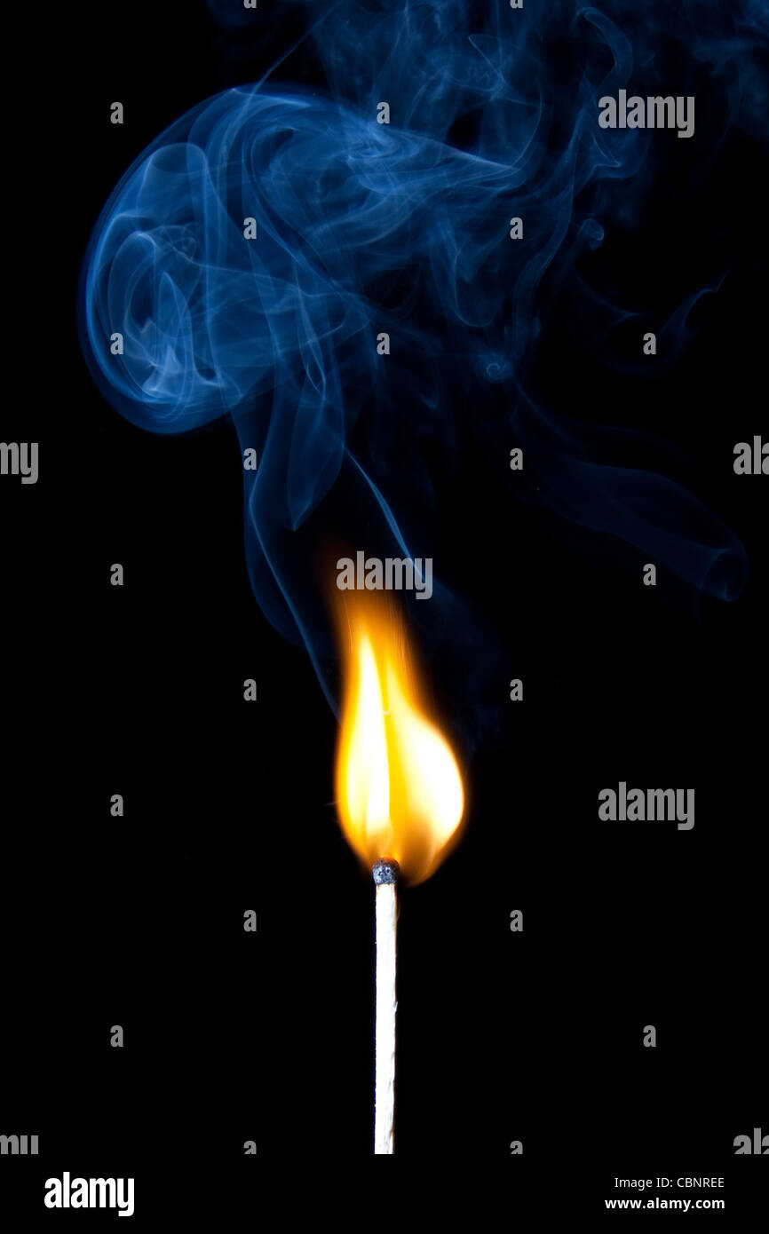 match burning with fire and smoke isolated on black background Stock ...
