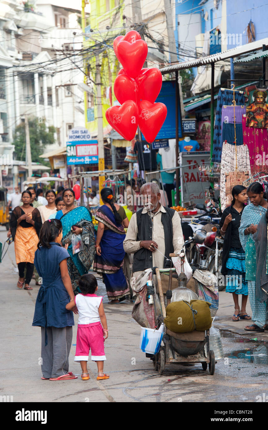 Female balloon seller hi-res stock photography and images - Alamy