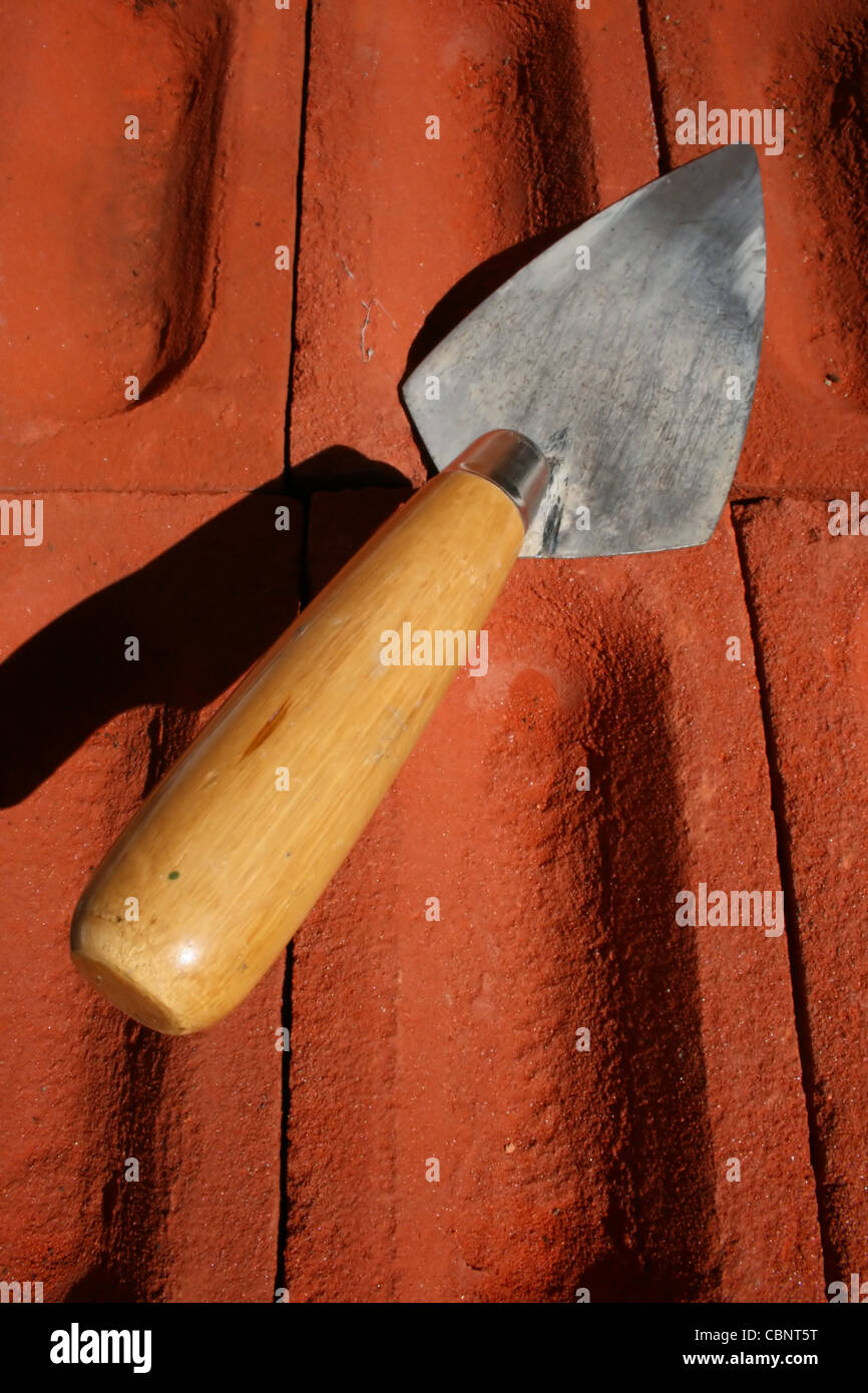 Bricklayers trowel on bricks Stock Photo - Alamy