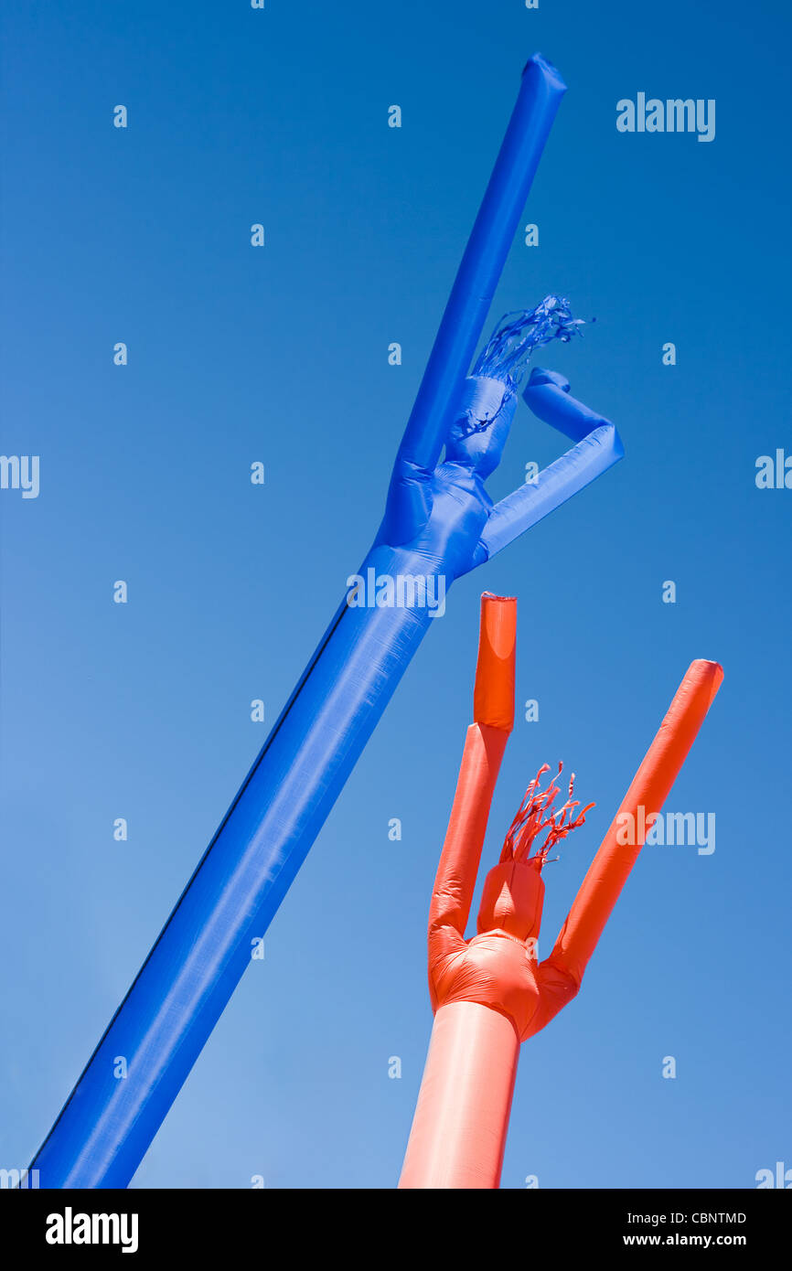 Blown up high by a windmachine fabrique puppets are dancing in the air ...