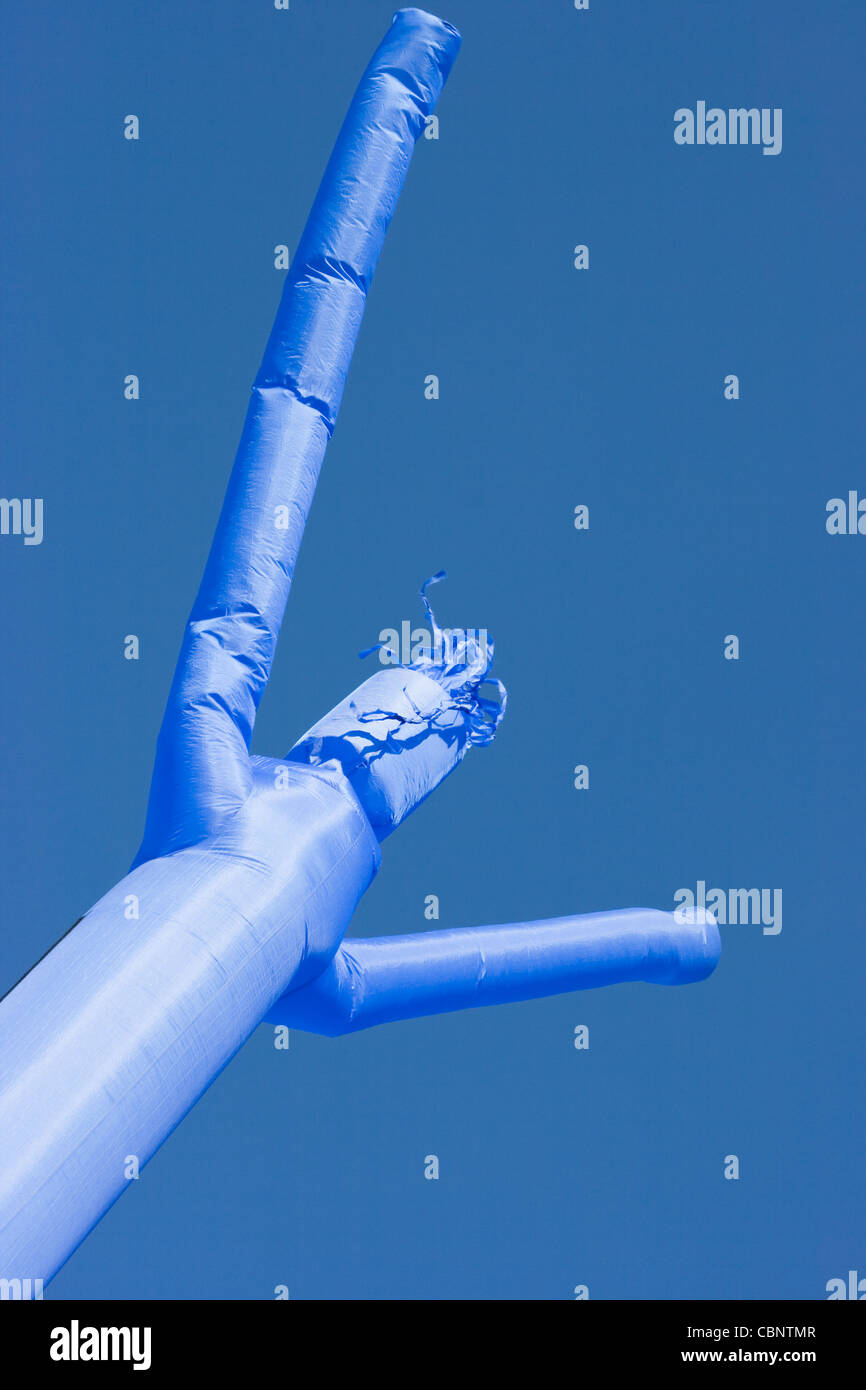 Blown up high by a windmachine a fabrique puppet is dancing in the air ...