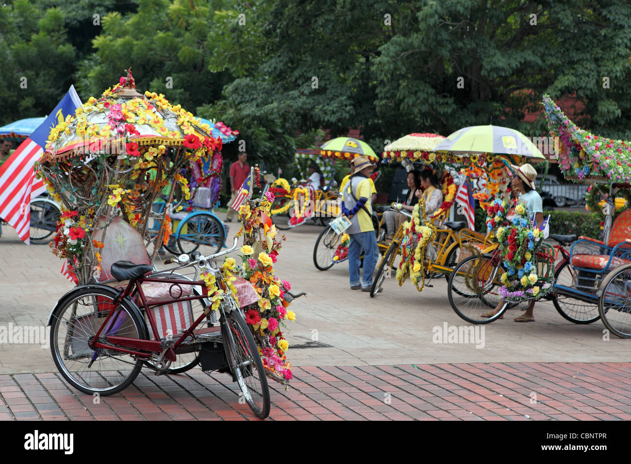 Colorful floral rickshaws parked near the Porta de Santiago. Melaka ...