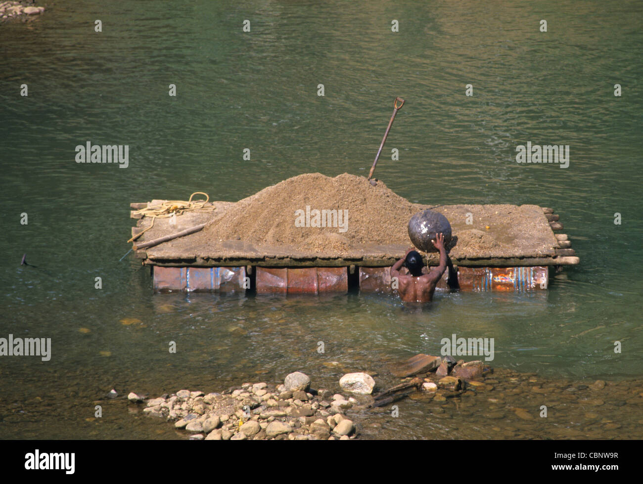 River sand miner (diver) working on barge, Kandy, Sri Lanka Stock Photo ...