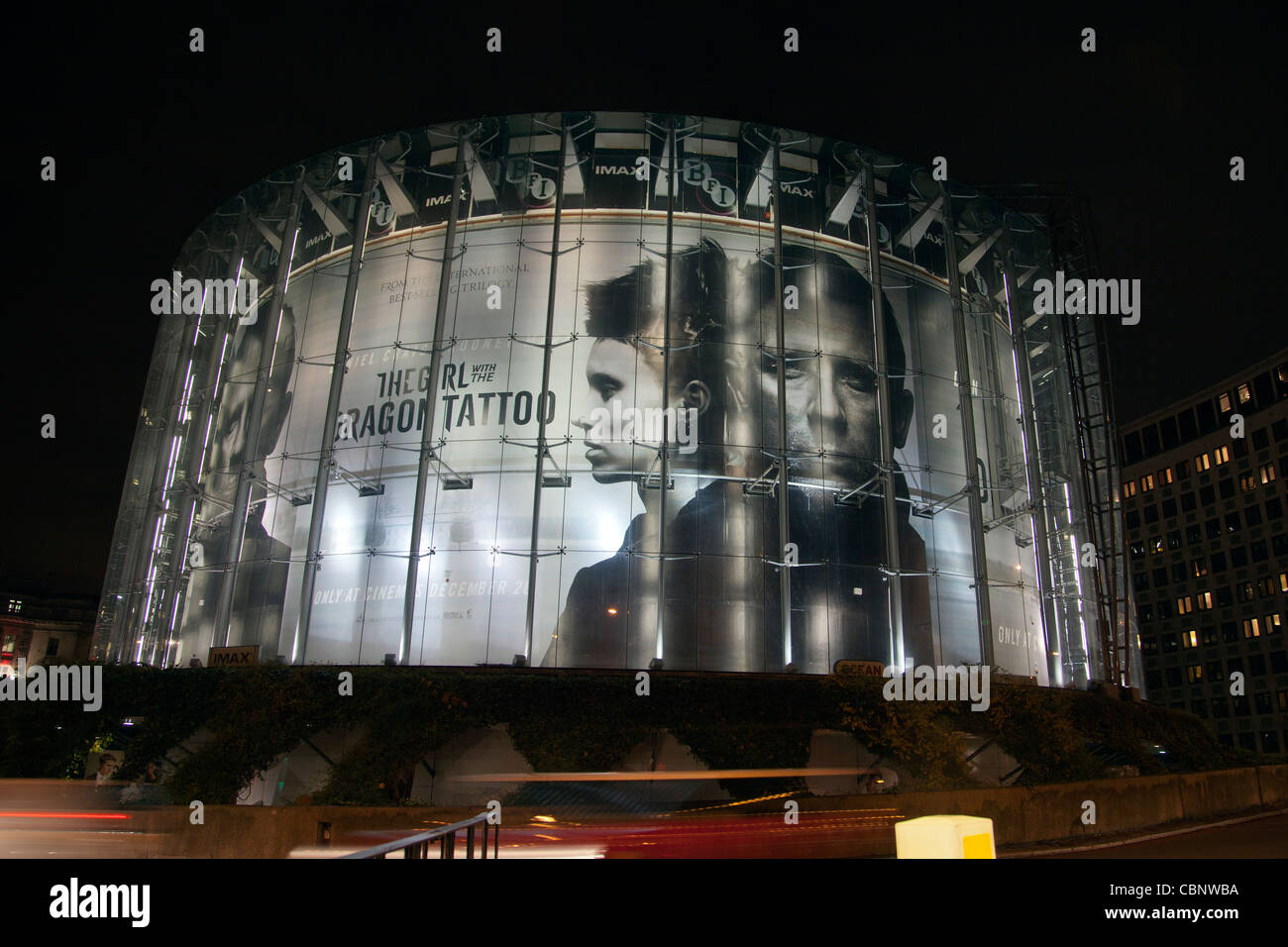 London IMAX cinema at night with a display showing the Girl with the ...