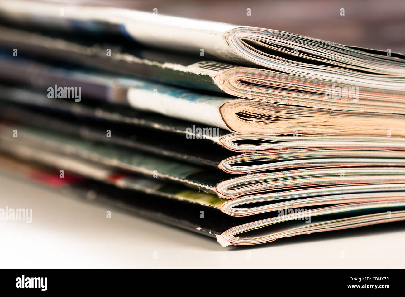 A large stack of magazines piled high Stock Photo - Alamy