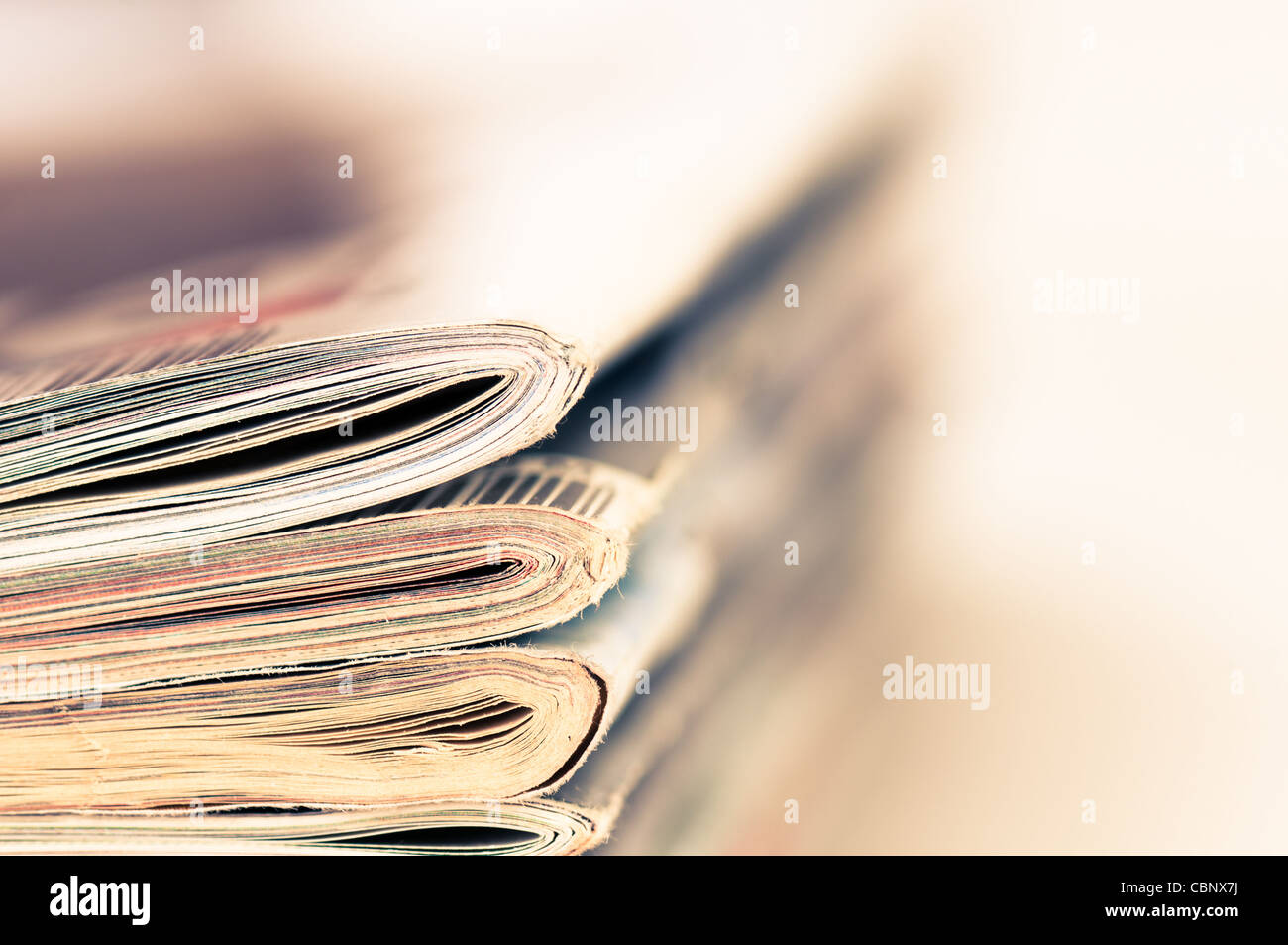 A large stack of magazines piled high Stock Photo - Alamy