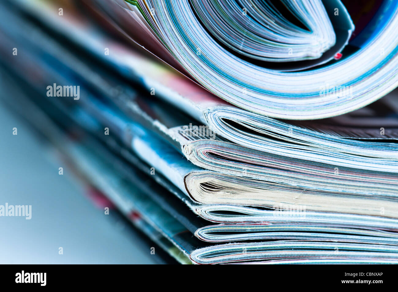 Magazine Roll. Side view. Blue toned Stock Photo - Alamy