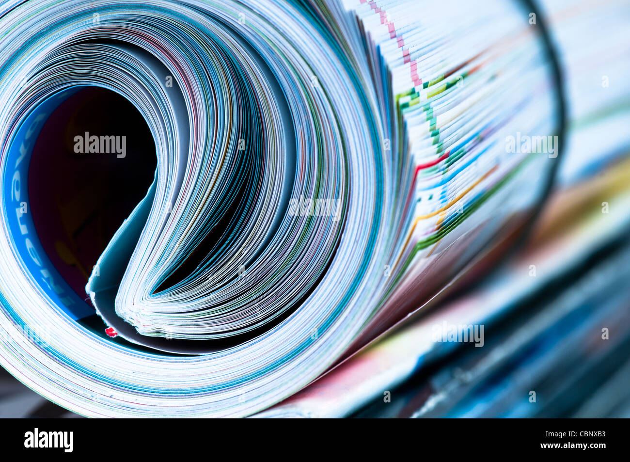 Magazine Roll. Side view. Blue toned Stock Photo - Alamy