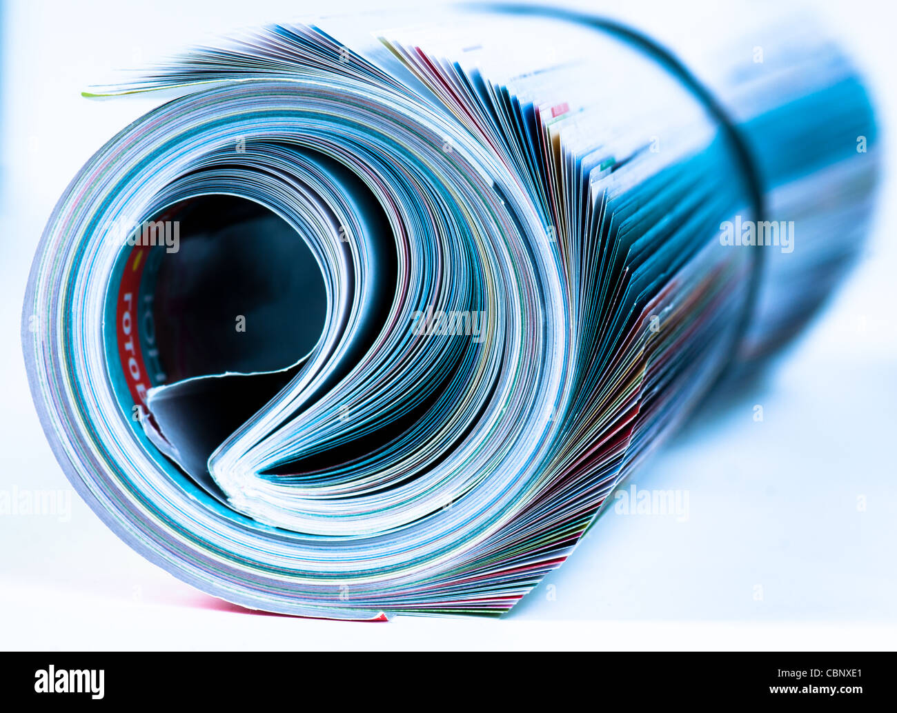 Magazine Roll. Side view. Blue toned Stock Photo - Alamy
