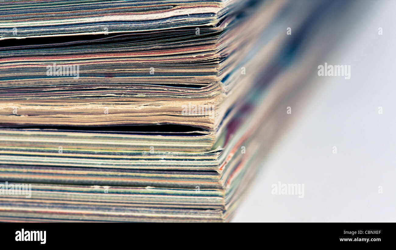A large stack of magazines piled high Stock Photo - Alamy