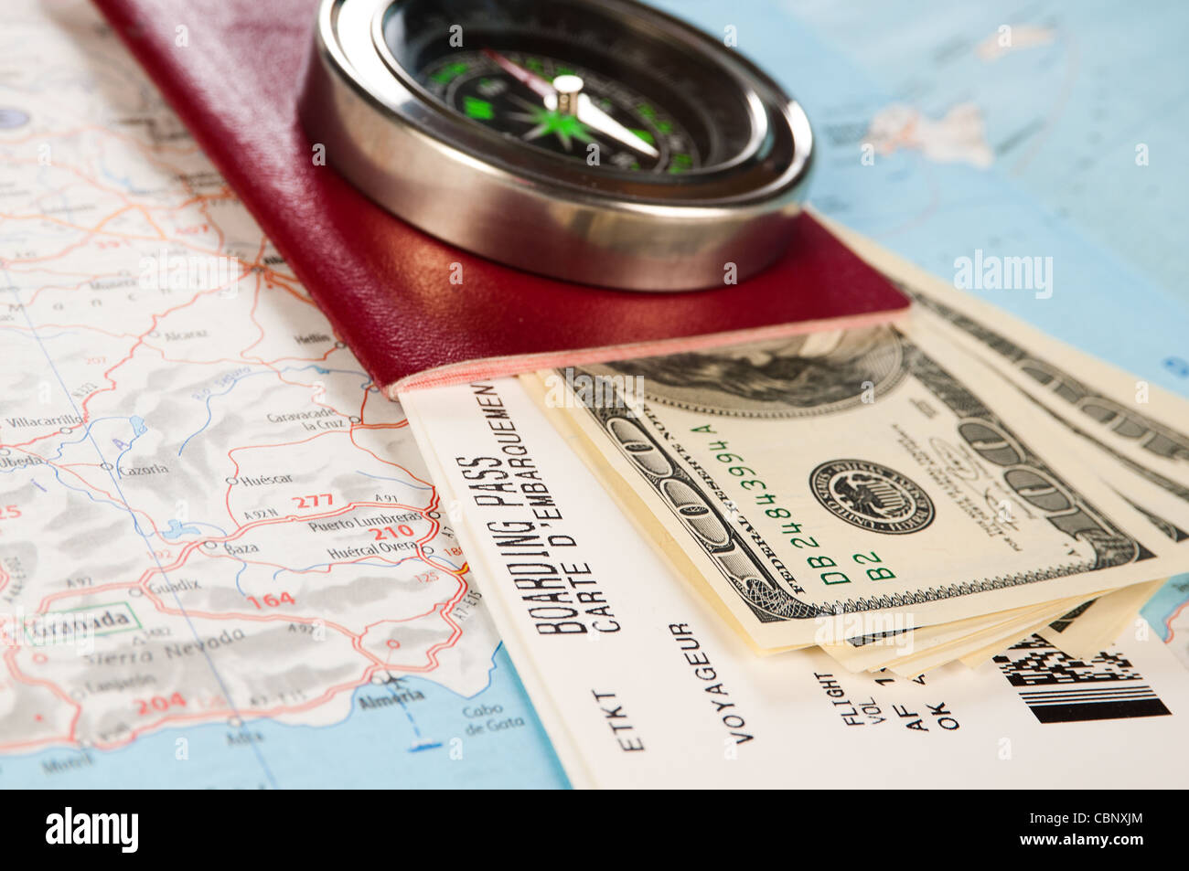 compass, money and passport with boarding pass Stock Photo - Alamy
