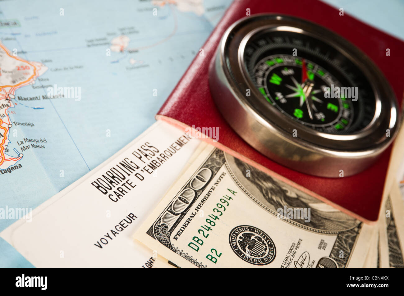compass, money and passport with boarding pass Stock Photo - Alamy