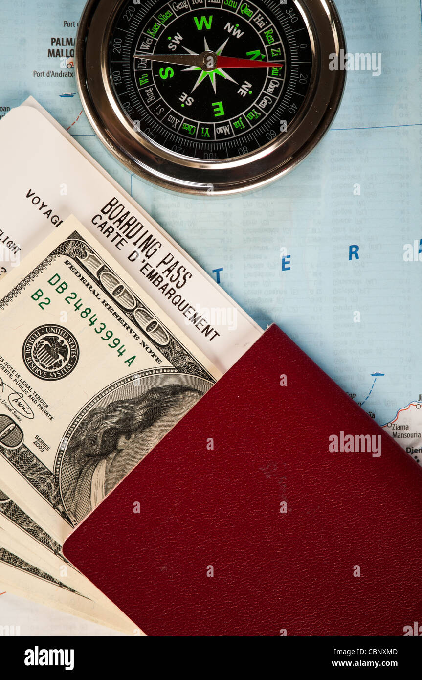 compass, money and passport with boarding pass Stock Photo - Alamy