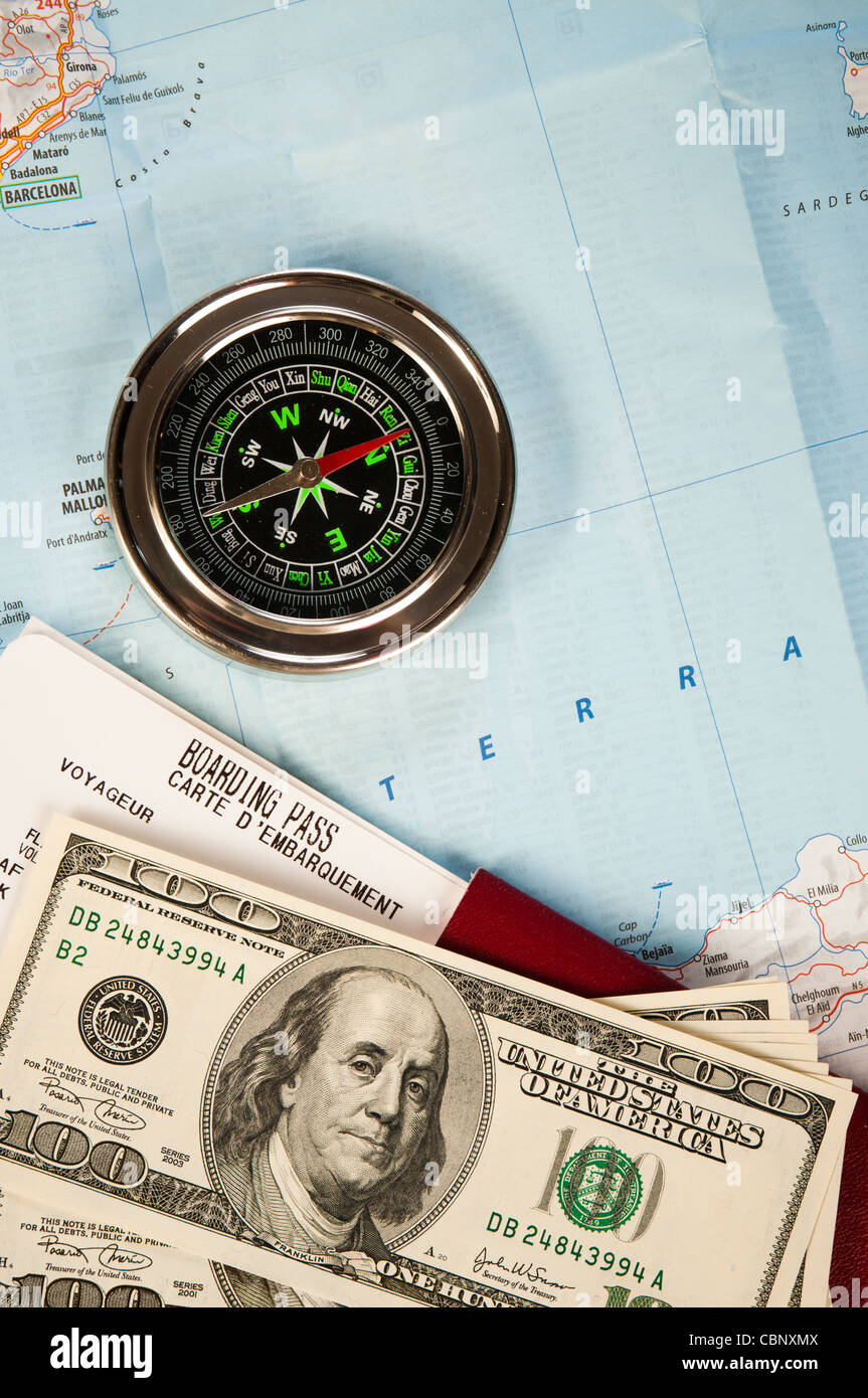 compass, money and passport with boarding pass Stock Photo - Alamy