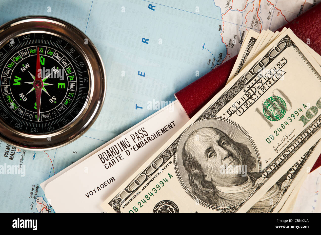 compass, money and passport with boarding pass Stock Photo - Alamy