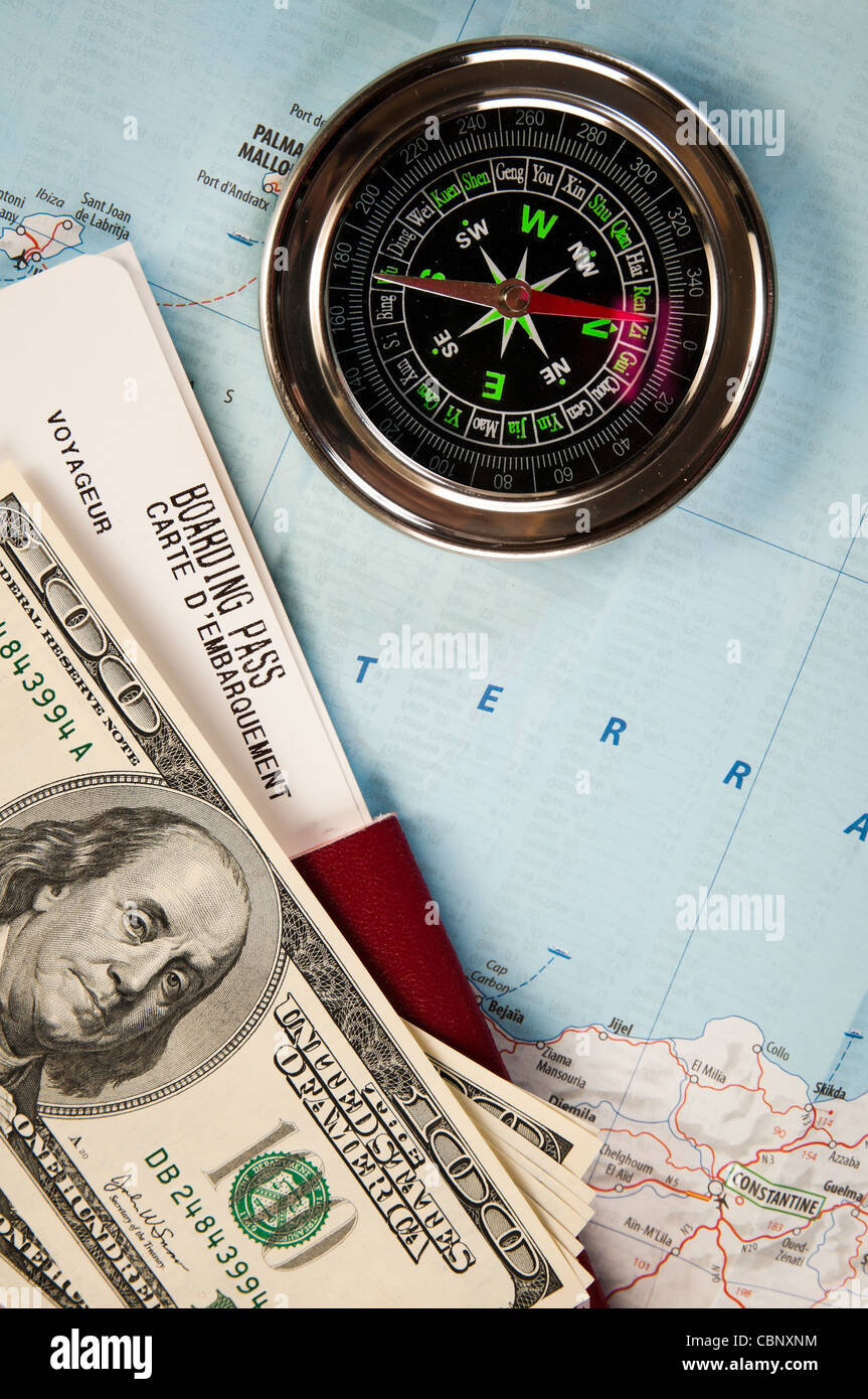compass, money and passport with boarding pass Stock Photo - Alamy
