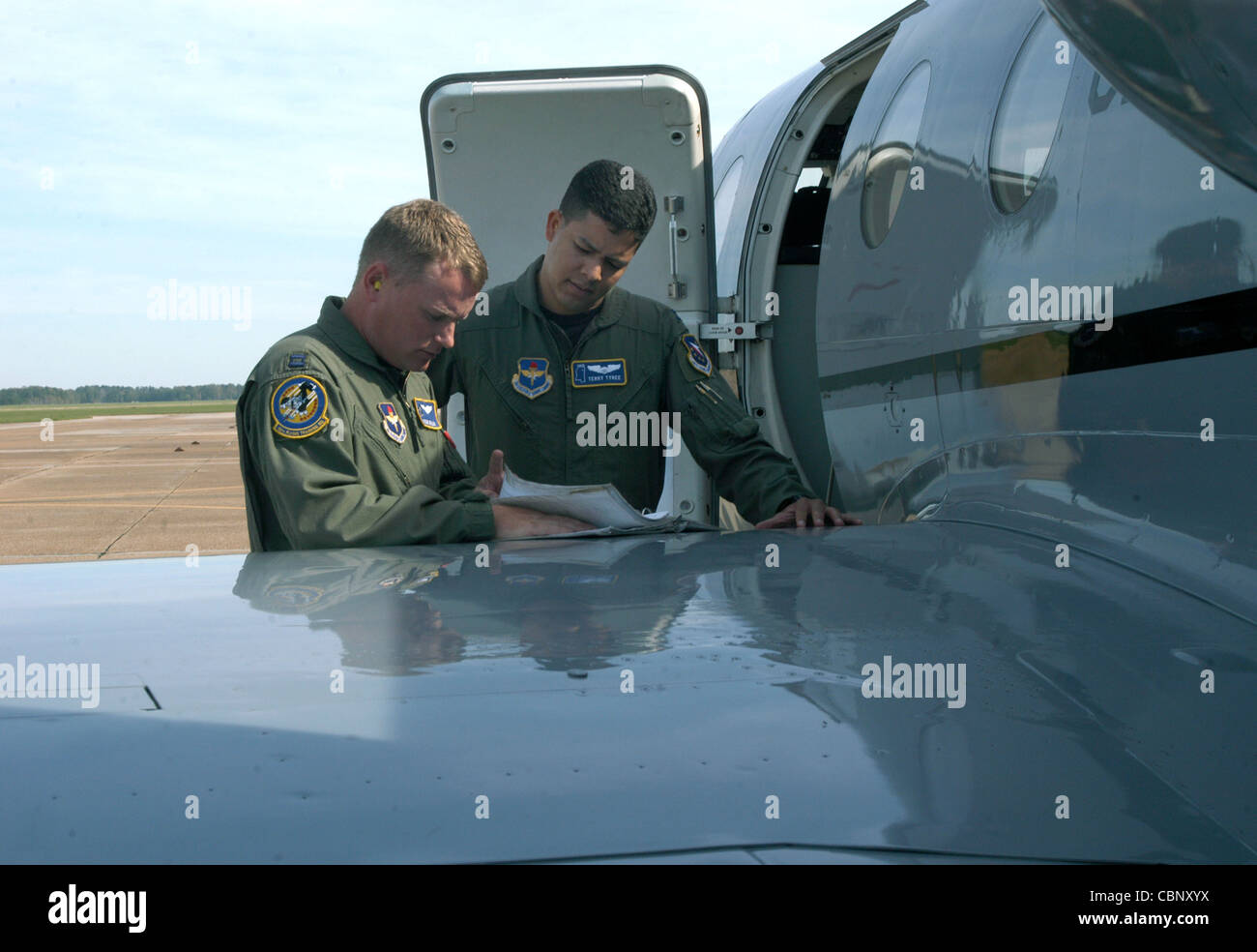 COLUMBUS AIR FORCE BASE, Miss. -- Capt. Stephen Miller (left) reviews ...
