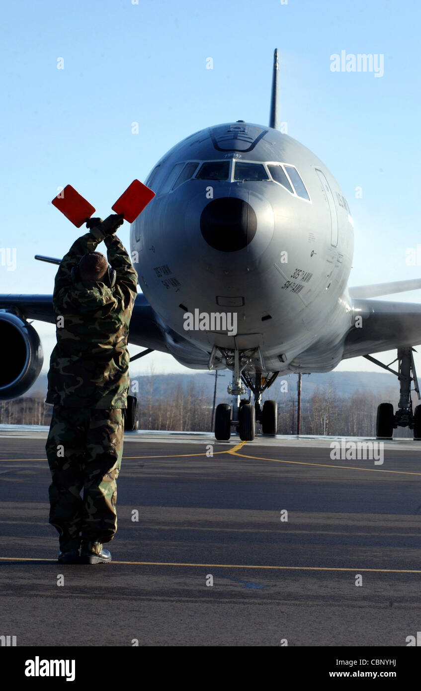 Staff Sgt. Martin Walker proceeds into place to marshal a KC-10 ...