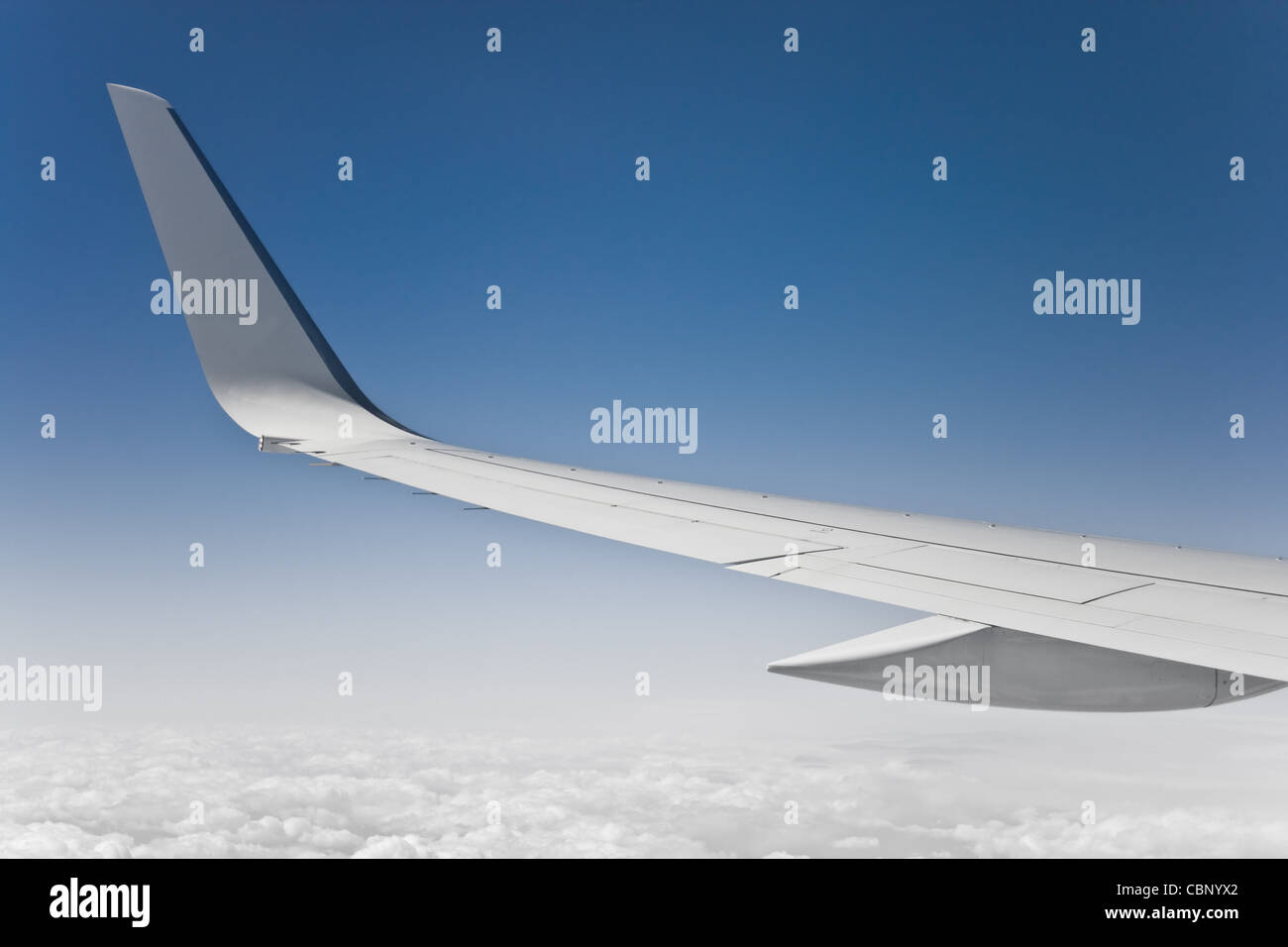 view of the jet plane wing and sky from passenger window Stock Photo ...