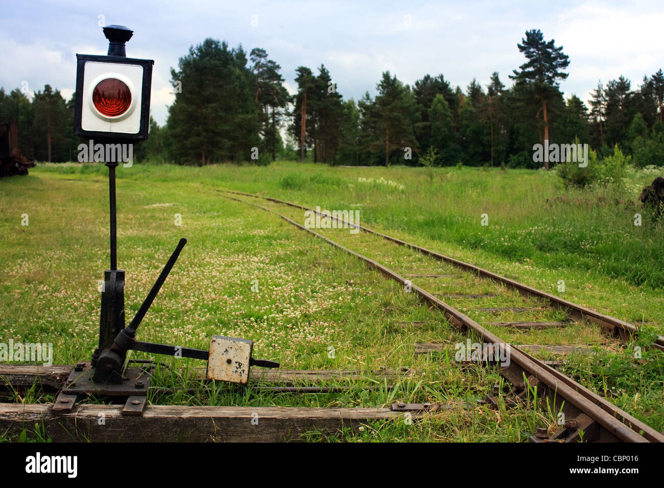 landscape with old rusty railroad and traffic light Stock Photo - Alamy
