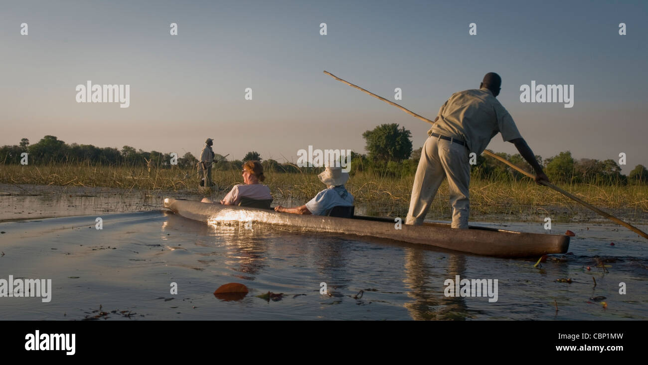 Africa Botswana Okavango Delta-People in Mokoro (dug-out canoe Stock ...