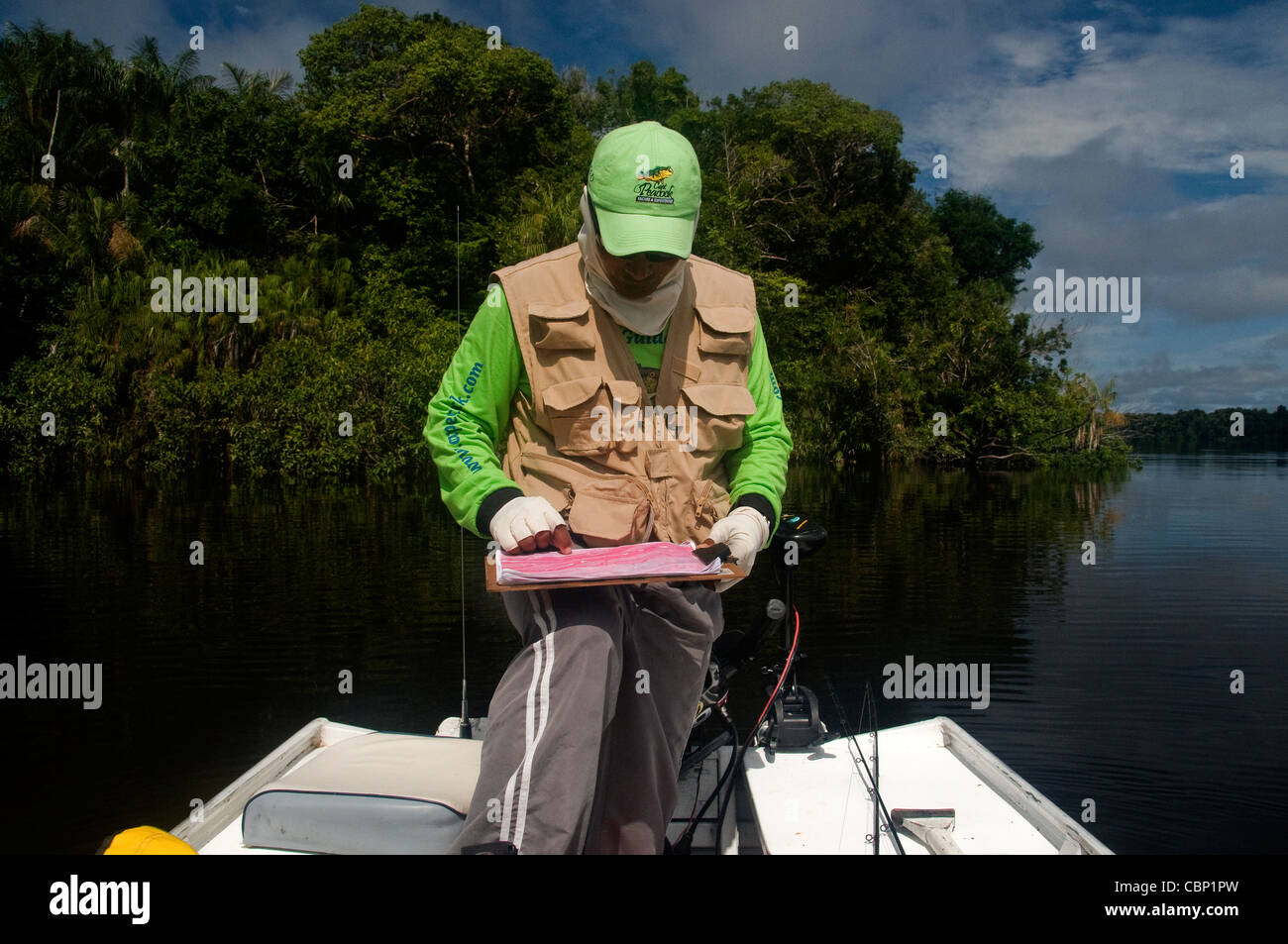 A guide reviews his map in search of a remote lagoon in Brazil's Amazon ...