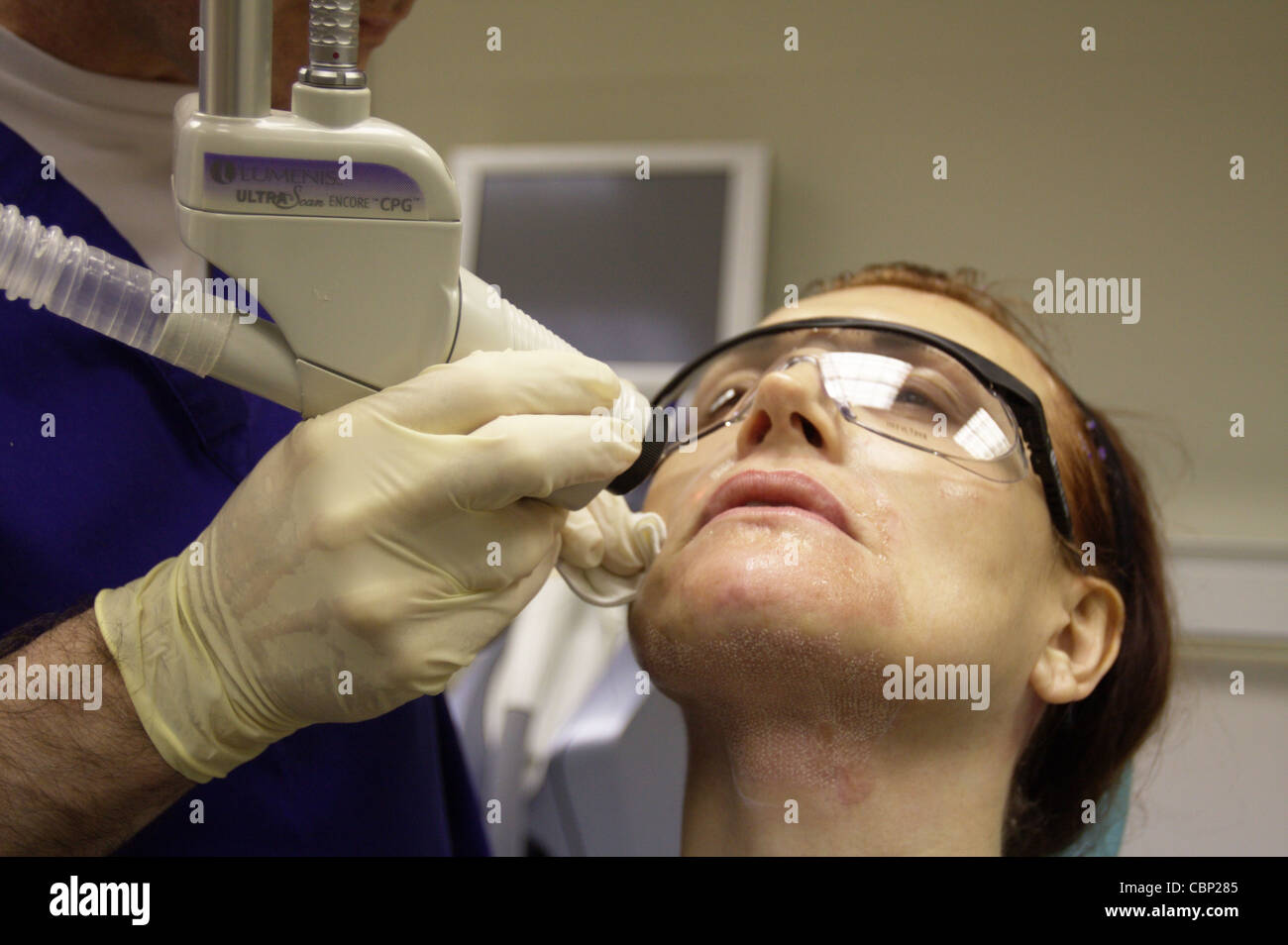 Doctor performs ipl laser cosmetic hi-res stock photography and images ...