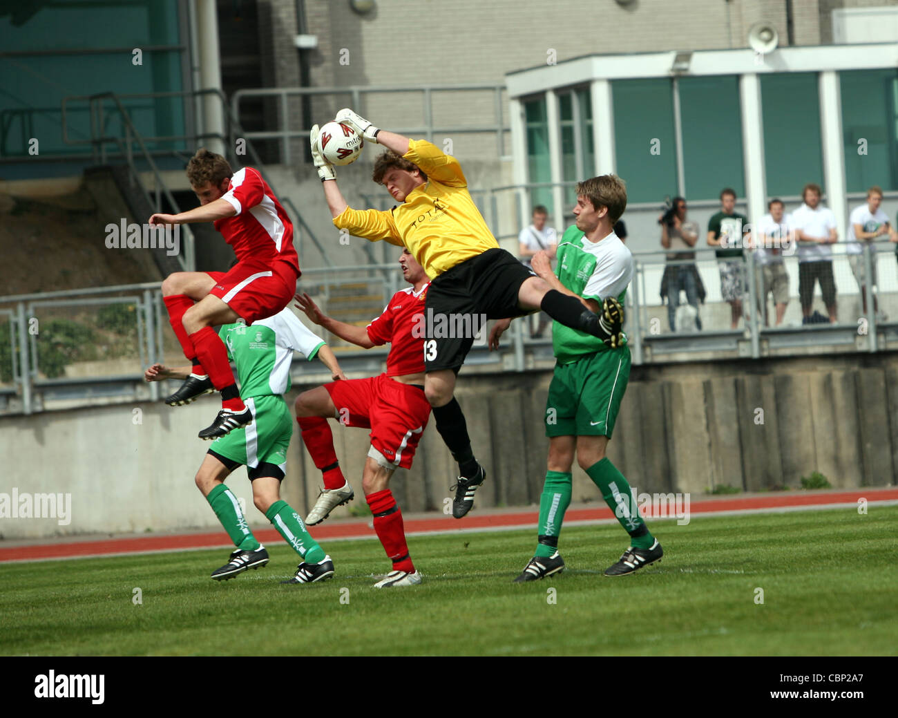 A goal keeper makes a safe during a university football match Stock ...