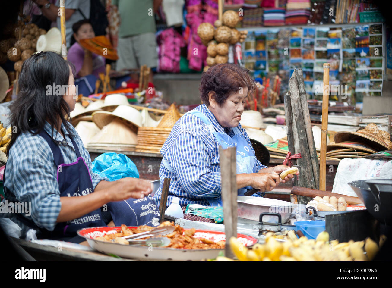 Asian women selling goods at a traditional Asian floating market near ...