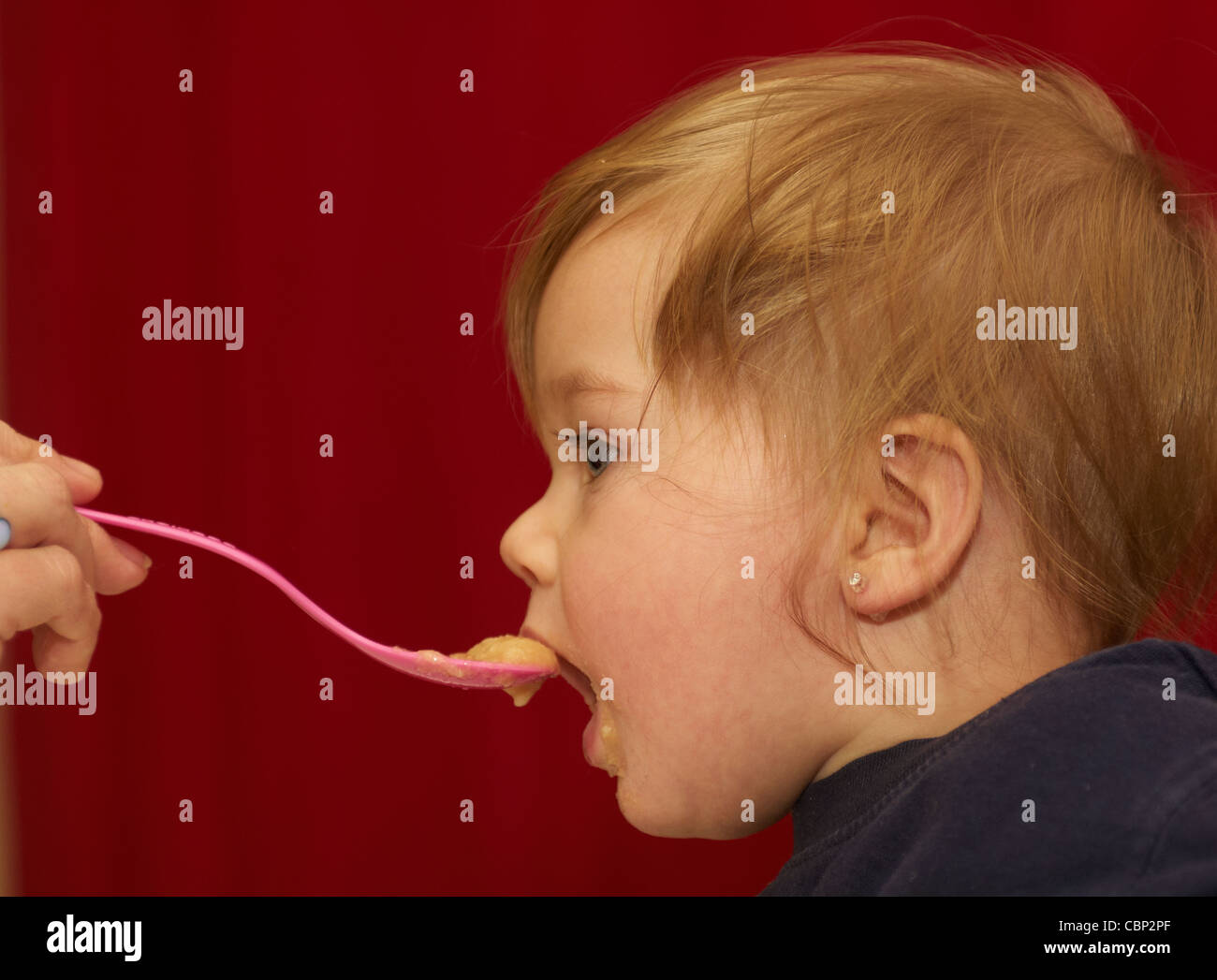 Spooning feed hi-res stock photography and images - Alamy