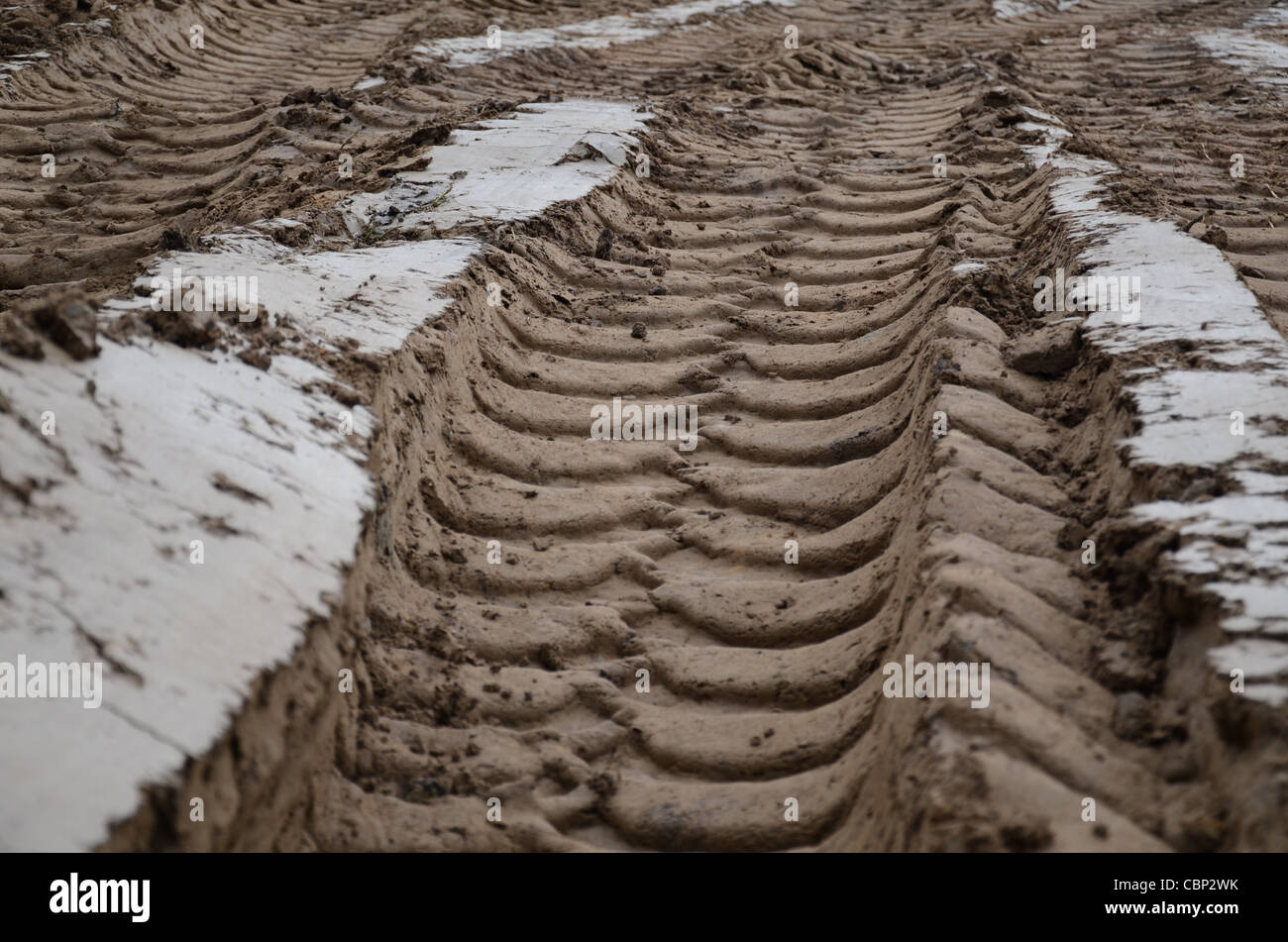 Muddy soil and track from a tractor Stock Photo - Alamy