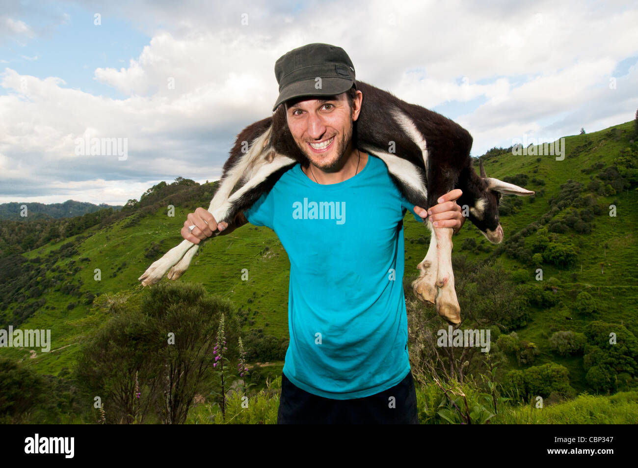 1 young backpackers with guide posing with shoot goat, goat hunting ...