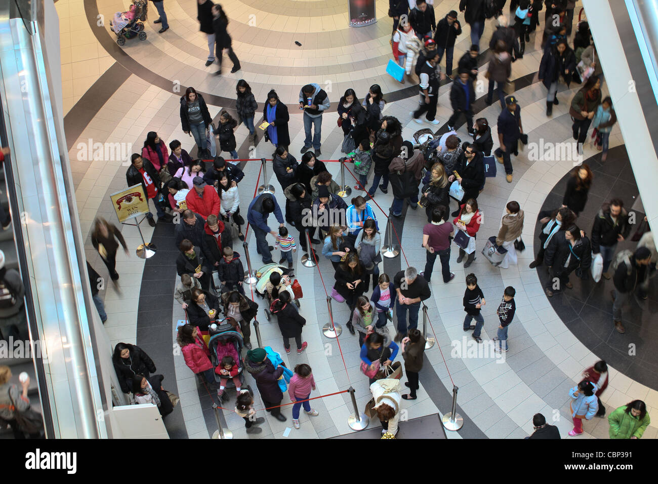 busy crowd inside shopping mall multi level Stock Photo - Alamy