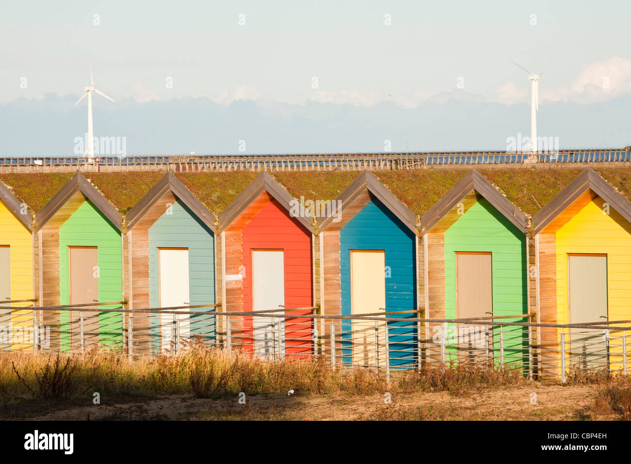 Colourful traditional British seaside beach huts on the beach in Blyth ...