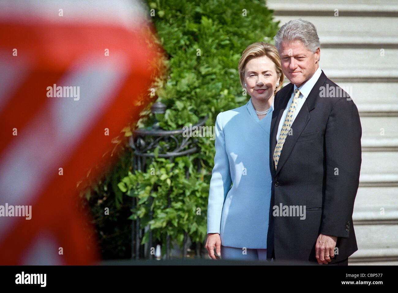 President Bill Clinton and first lady Hillary Rodham Clinton smile as ...