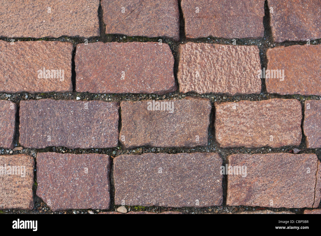 Old red stone blocks pavement Stock Photo - Alamy